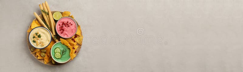 Different Delicious Hummuses on Light Table, Top View with Space for ...