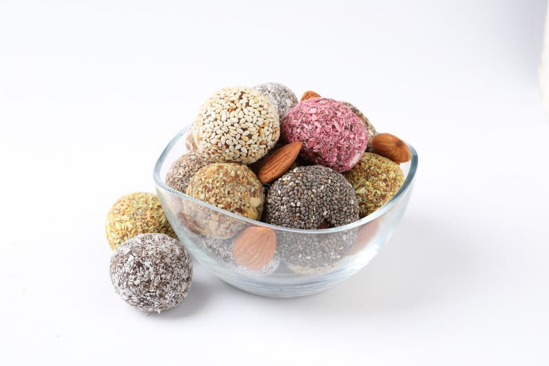 Different Delicious Vegan Candy Balls with Almonds on White Background ...