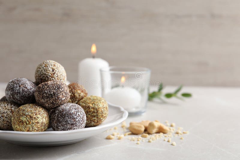 Different Delicious Vegan Candy Balls on Light Grey Marble Table. Space ...