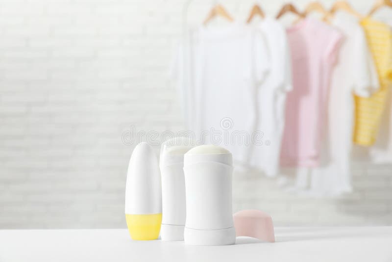 Different Deodorants on White Table in Room Stock Photo - Image of ...