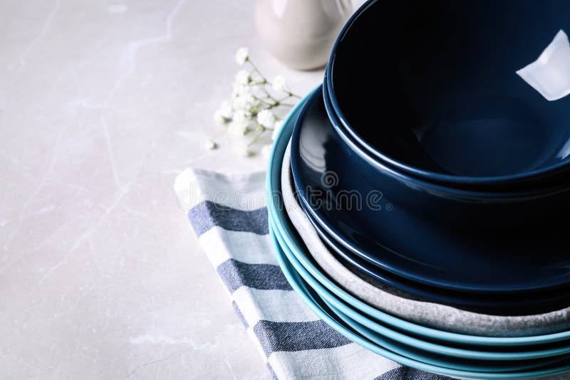 Different Dishware on Light Grey Marble Table, Space for Text Stock ...