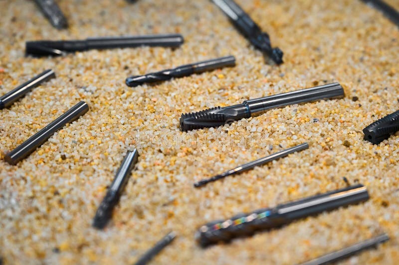 Different Drilling Tools on Sand Surface in Workshop Stock Image ...