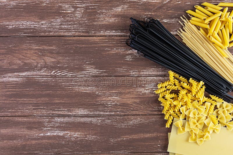 Different Dry Pasta on a Wooden Background. Top View Stock Image ...
