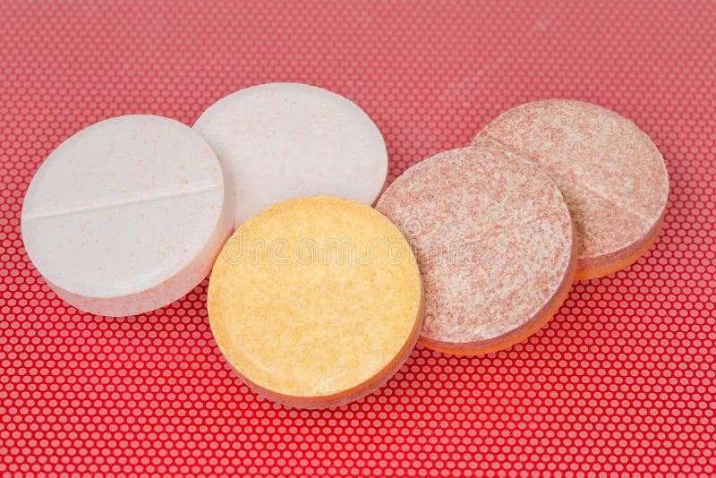 Effervescent Tablets on Red Surface, Close-up in Selective Focus Stock ...