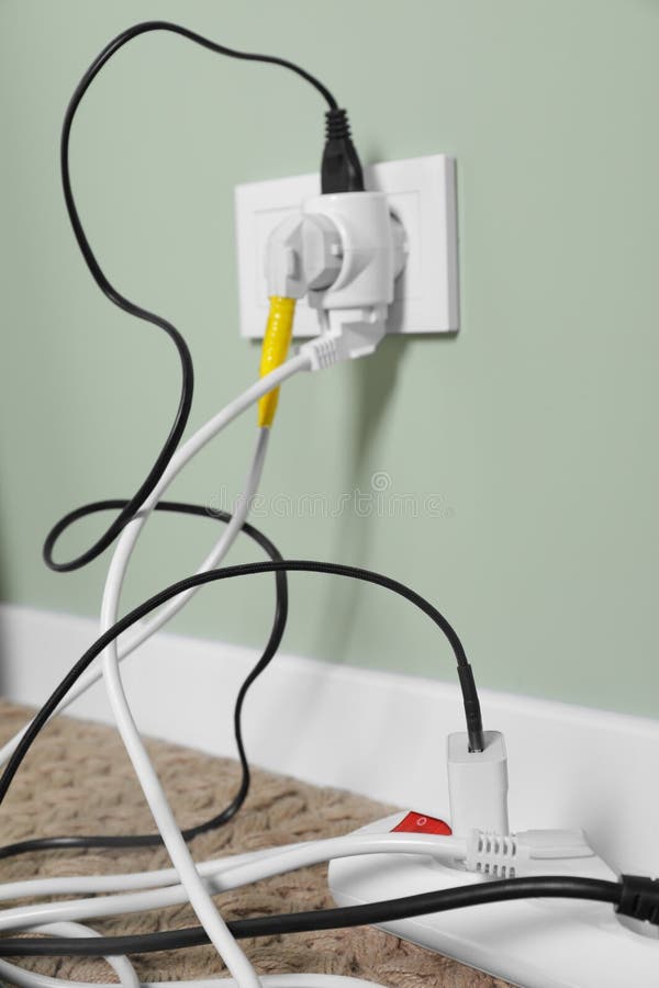 Different Electrical Plugs in Socket and Power Strip on Floor Indoors ...