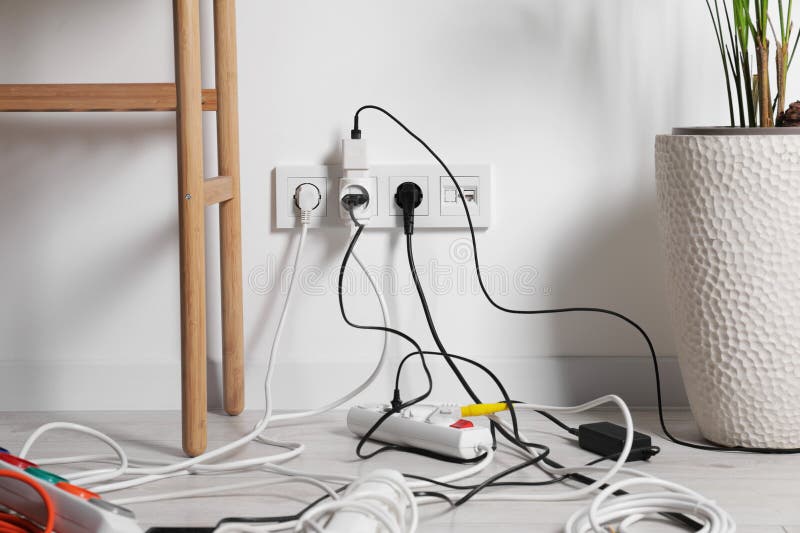 Different Electrical Plugs in Socket and Power Strip on Floor Indoors ...