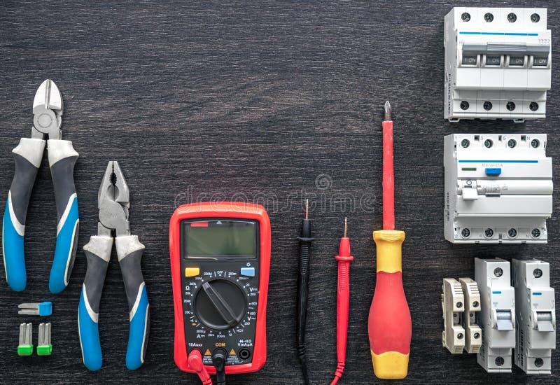 Different Electrical Tools on Wooden Background, Flat Lay. Stock Photo ...