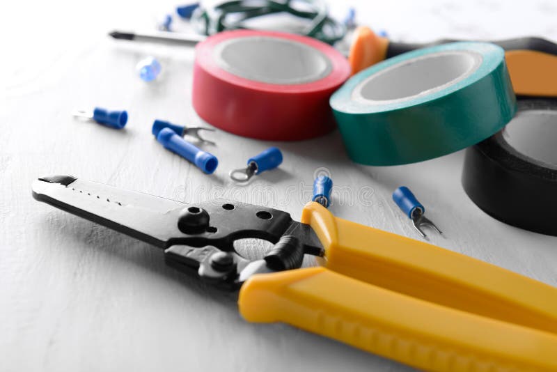Different Electrician S Supplies with Wire Stripper on Table Stock ...