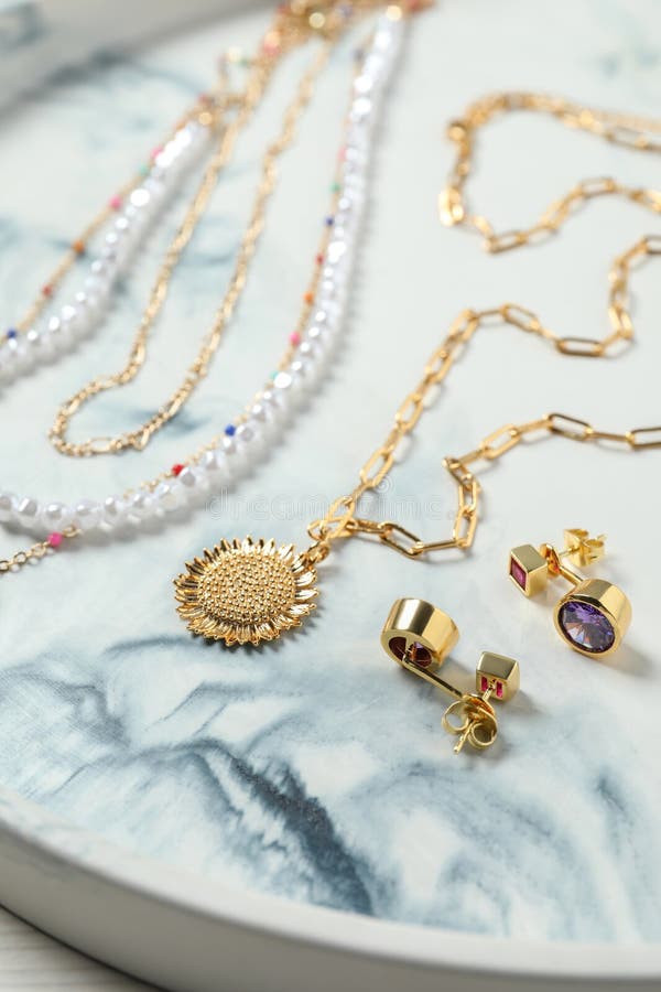 Different Elegant Bijouterie on Color Tray, Closeup Stock Image - Image ...