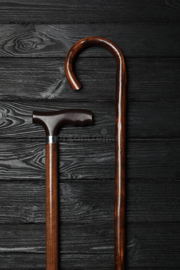 Different Elegant Walking Canes on Wooden Table, Flat Lay Stock Image ...