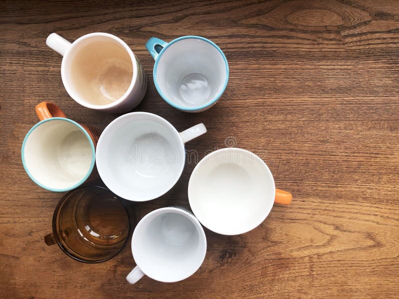 Empty Mugs of Different Shapes and Sizes on the Table Stock Photo ...