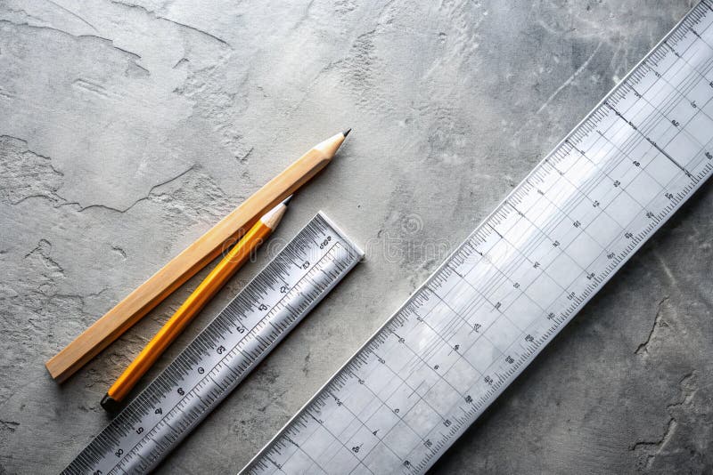 Different Engineering Drawings, Ruler, and Pencil on Grey Textured ...