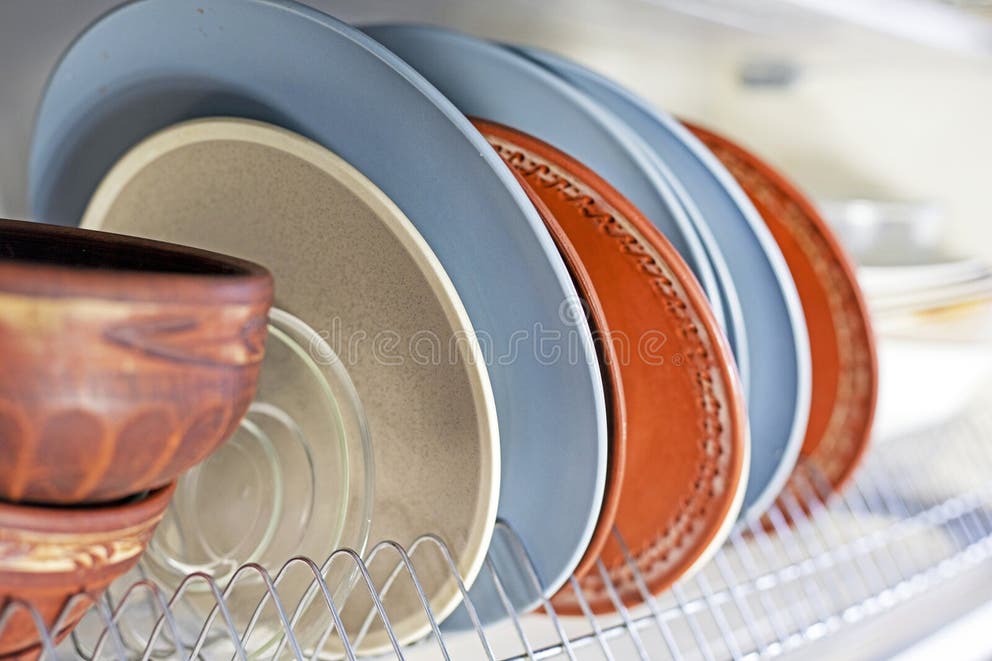 Different Food Plates Stand in the Kitchen Cabinet. Stock Photo - Image ...