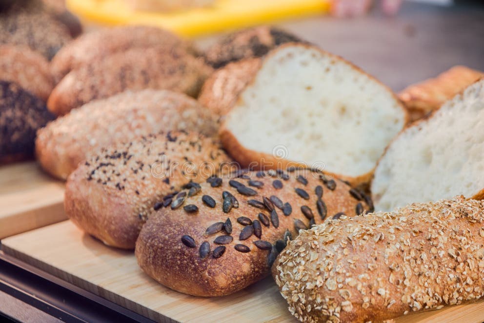 Different Fresh Bread on the Shelves in Bakery. Selective Focus Stock ...