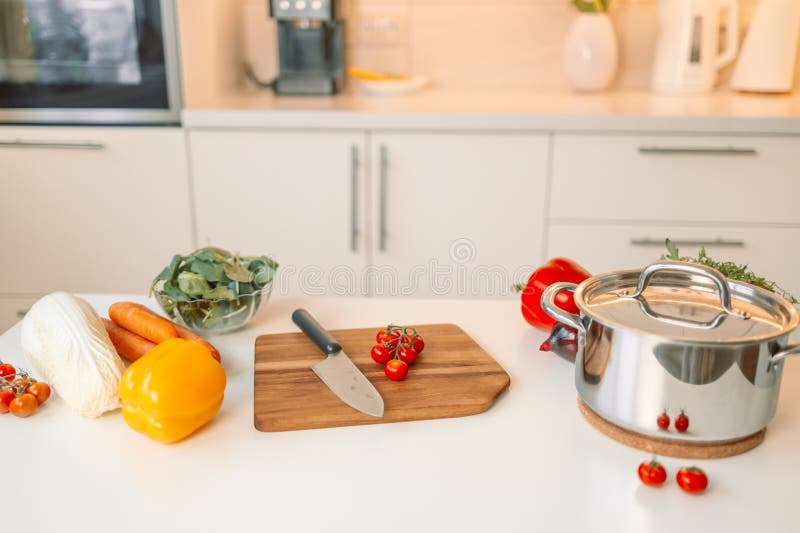 Different Fresh Vegetables on White Table in Modern Kitchen. Products ...