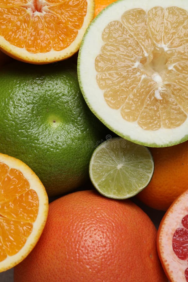 Different Fresh Whole and Cut Citrus Fruits As Background, Top View ...