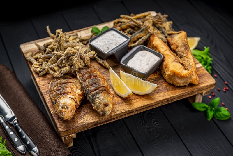 Different Fried Fish on the Board Stock Image - Image of board ...