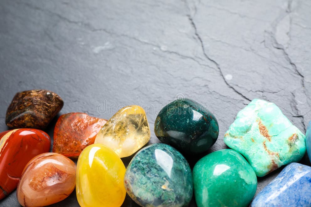 Different Gemstones on Grey Table, Closeup. Stock Image - Image of ...