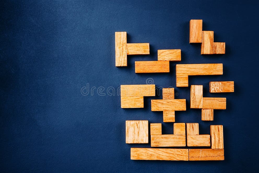 Different Geometric Shapes Wooden Blocks on a Dark Background. Creative ...