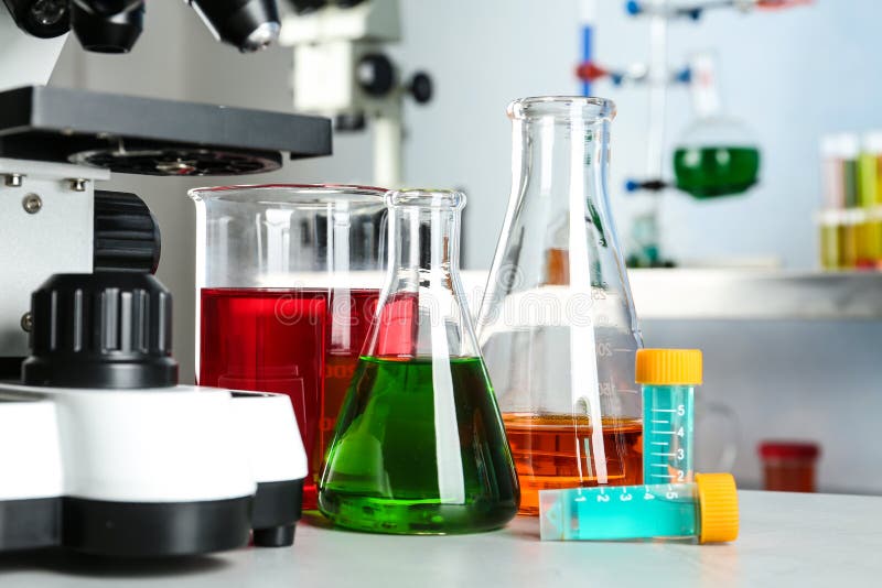 Different Glassware with Samples on Table in Laboratory Stock Photo ...
