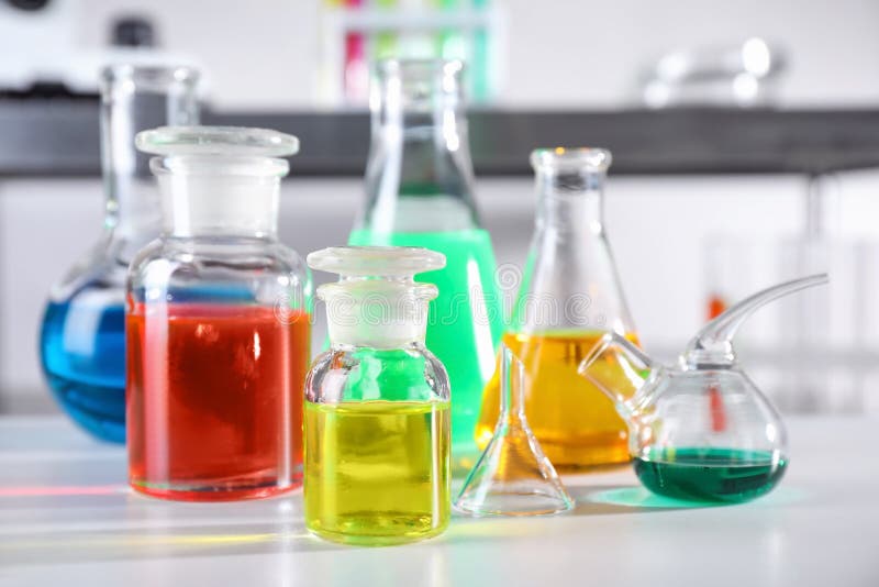 Different Glassware with Samples on Table in Laboratory Stock Photo ...