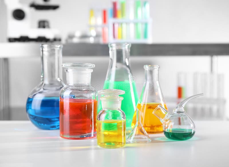 Different Glassware with Samples on Table in Laboratory Stock Image ...