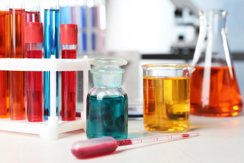 Different Glassware with Samples on Table in Laboratory Stock Image ...