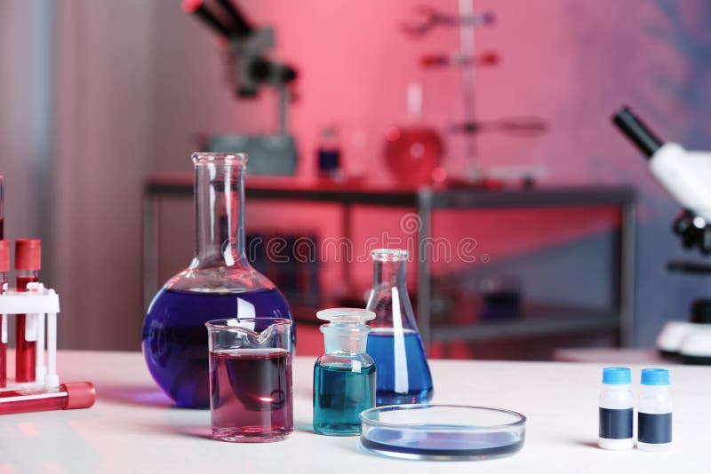 Different Glassware with Samples on Table in Laboratory Stock Photo ...