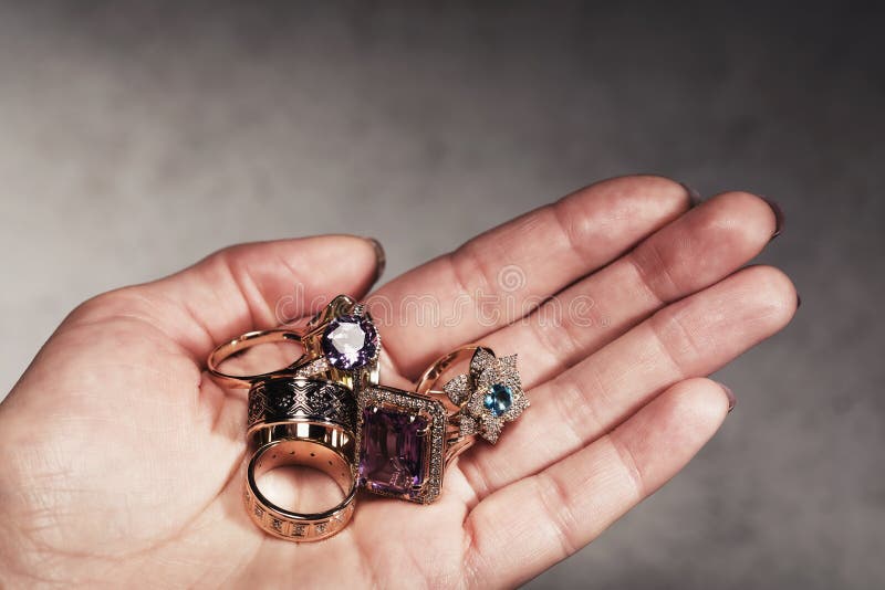 Different Gold Rings in Hand Close-up. Precious Metal Scrap Stock Image ...