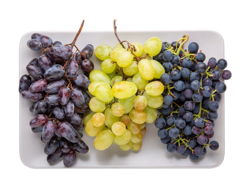 Different Grape Varieties on Gray Plate Isolated on White. Close-up ...