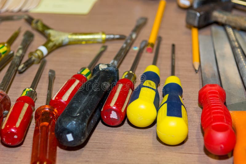 Different Hand Tools Stacked on a Wooden Table. Stock Photo - Image of ...
