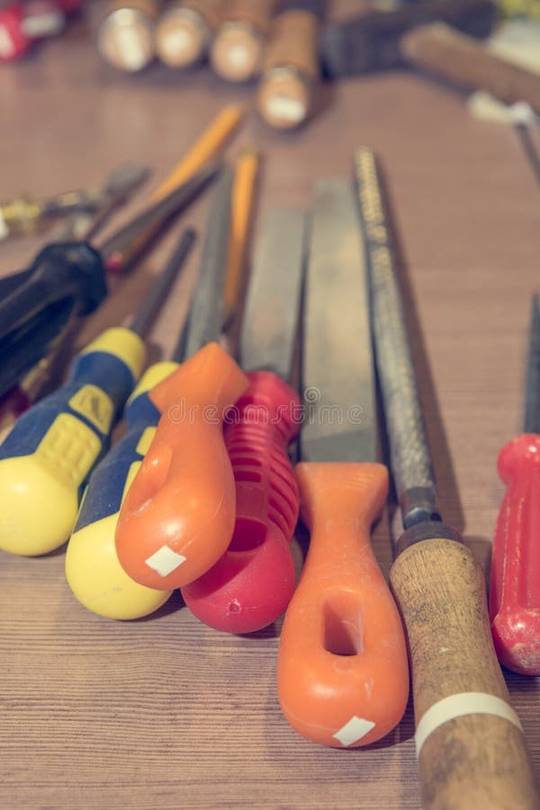Different Hand Tools Stacked on a Wooden Table. Stock Photo - Image of ...