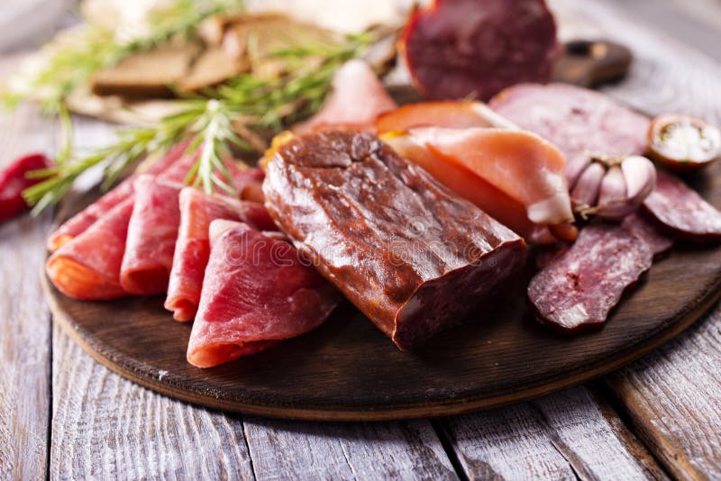 Different Italian Ham and Salami with Herbs Stock Photo - Image of ...