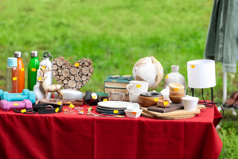 Different Items on Table Outdoors. Garage Sale Stock Image - Image of ...