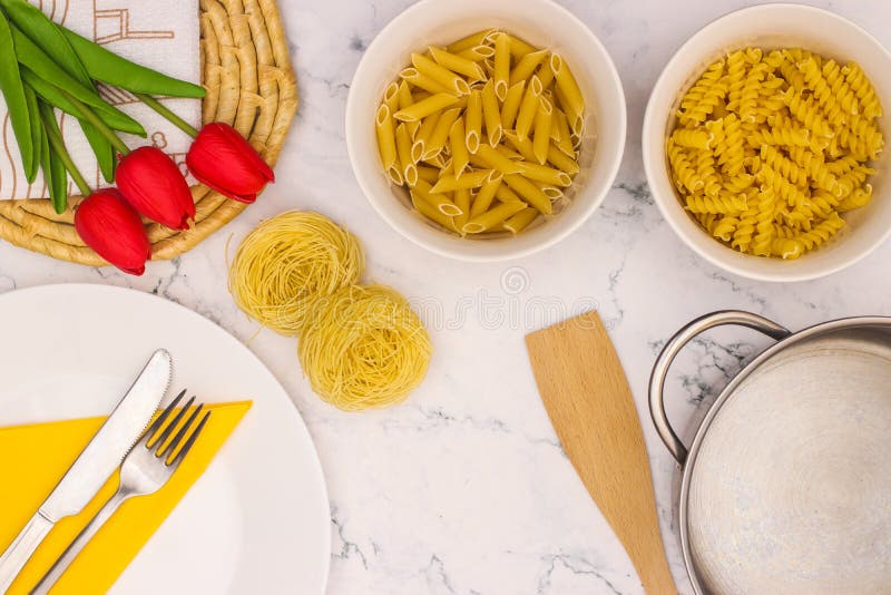 Different Kind of Pasta Served on the Table with Kitchen Supplies Stock ...