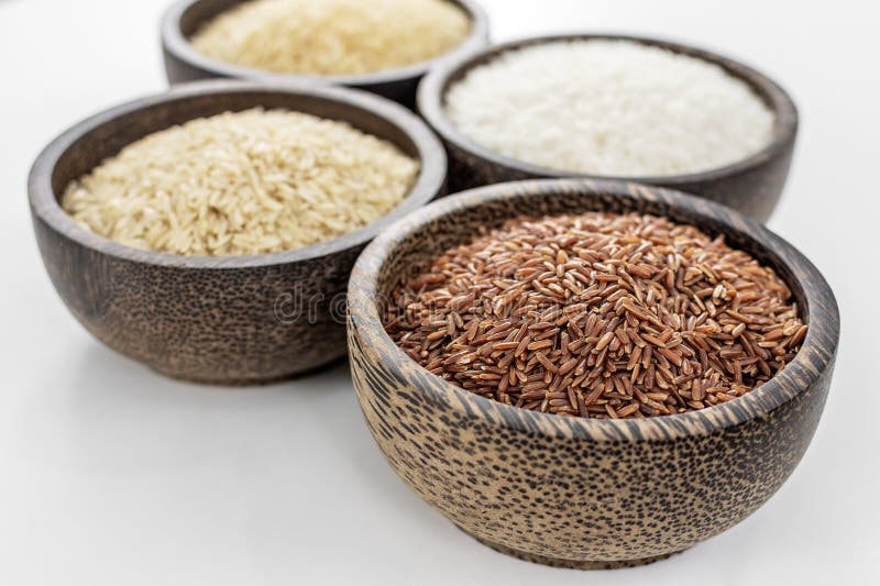 Different Kinds of Asian Rice Grains in Bowls on White Background Stock ...