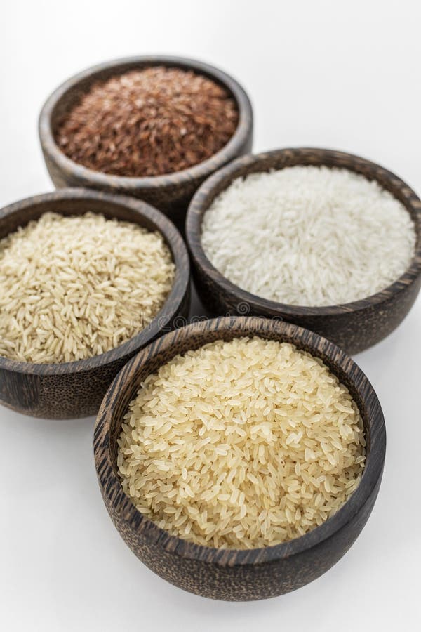 Different Kinds of Asian Rice Grains in Bowls on White Background Stock ...
