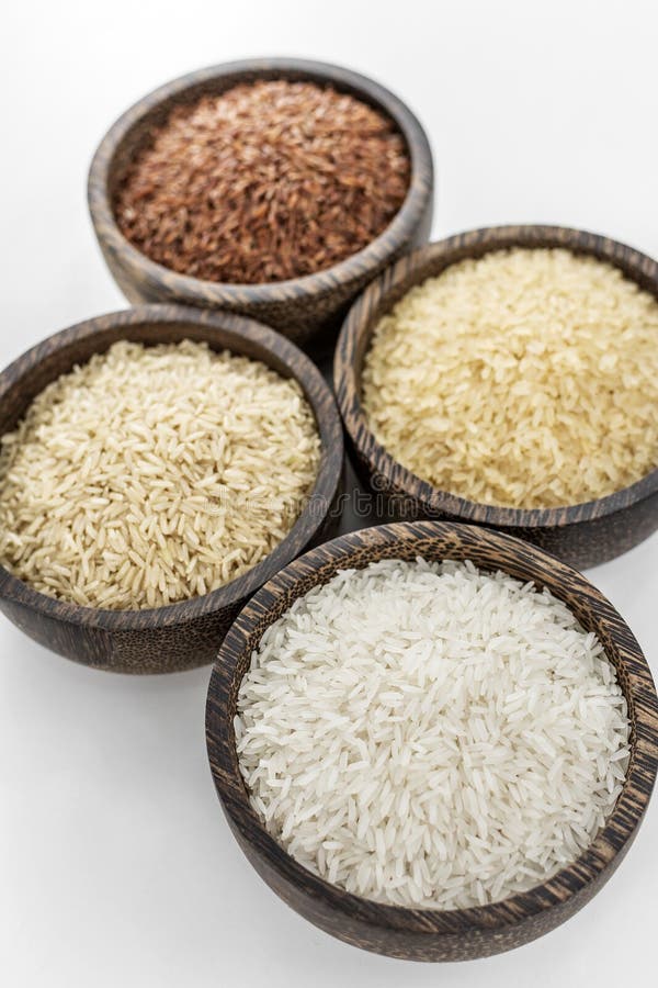 Different Kinds of Asian Rice Grains in Bowls on White Background Stock ...