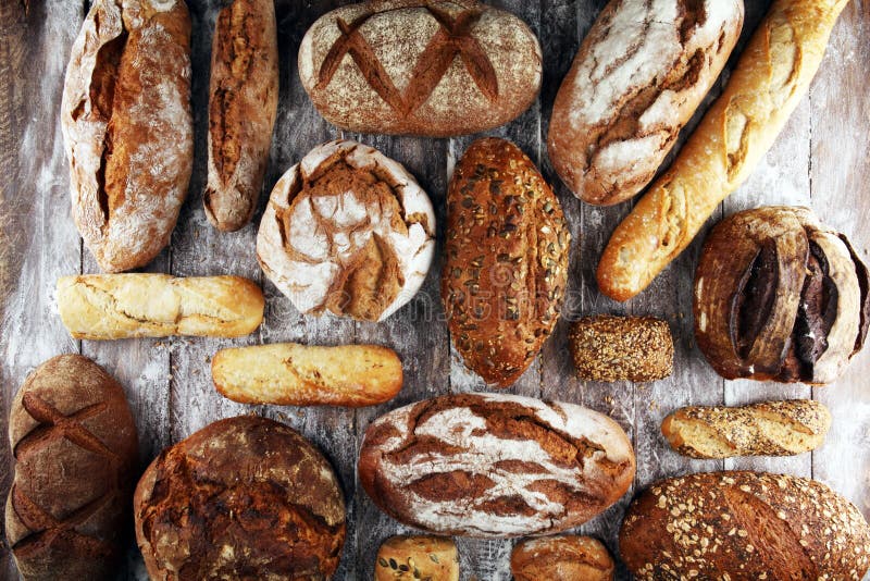 Different Kinds of Bread and Bread Rolls on Board from Above. Kitchen ...