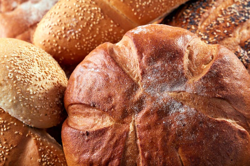 Different Kinds of Bread and Bread Rolls on Board from Above. Kitchen ...