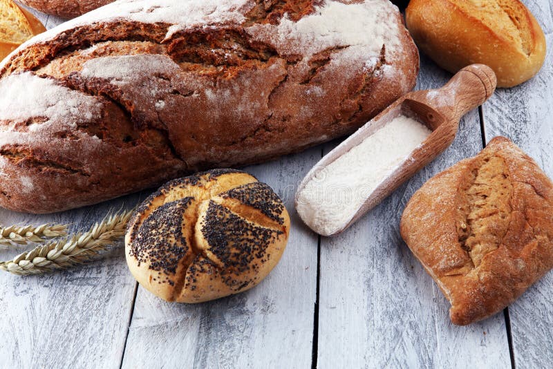 Different Kinds of Bread and Bread Rolls on White Board. Kitchen Stock ...