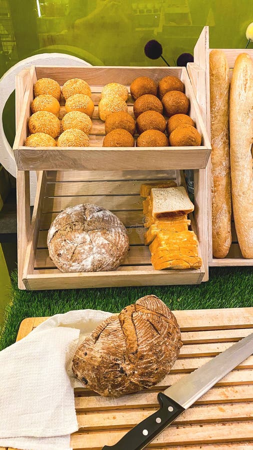 Different Kinds of Bread on the Counter in the Bakery Shop. Fresh Bread ...