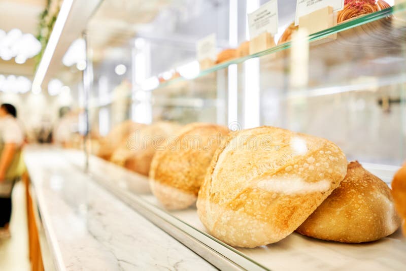 Different Kinds of Bread on the Counter in the Bakery Shop. Fresh Bread ...