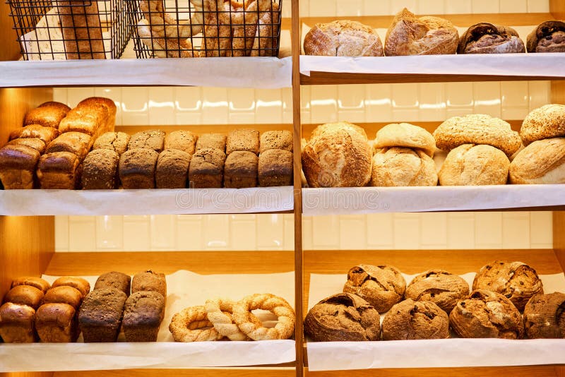 Different Kinds of Bread on the Counter in the Bakery Shop. Fresh Bread ...