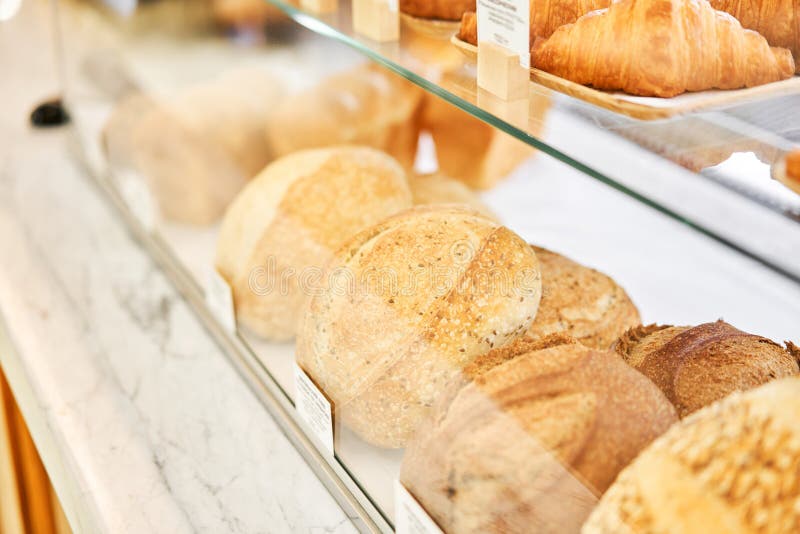 Different Kinds of Bread on the Counter in the Bakery Shop. Fresh Bread ...