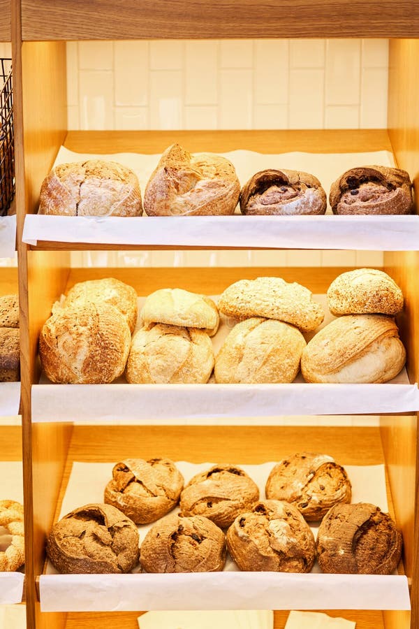 Different Kinds of Bread on the Counter in the Bakery Shop. Fresh Bread ...