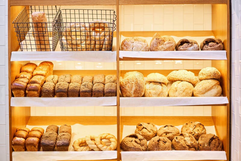 Different Kinds of Bread on the Counter in the Bakery Shop. Fresh Bread ...