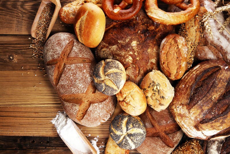 Different Kinds of Bread and Bread Rolls on Board from Above. Kitchen ...