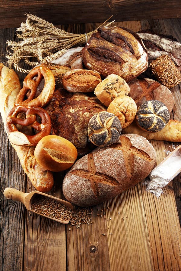 Different Kinds of Bread and Bread Rolls on Board from Above. Kitchen ...