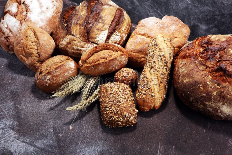 Different Kinds of Bread and Bread Rolls on Board from Above. Kitchen ...